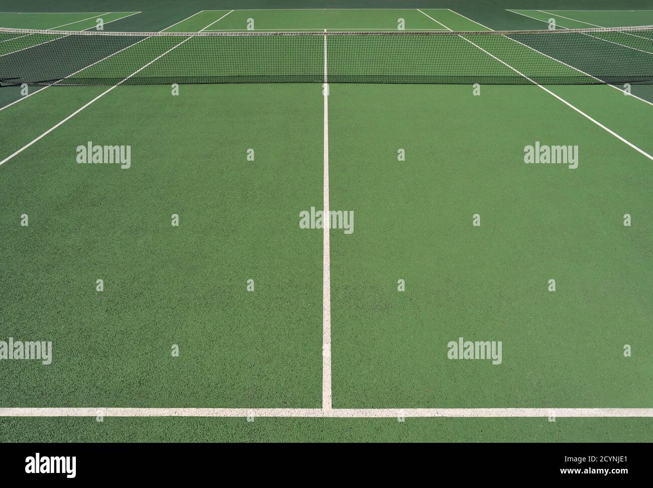 Green empty tennis court and net Stock Photo - Alamy