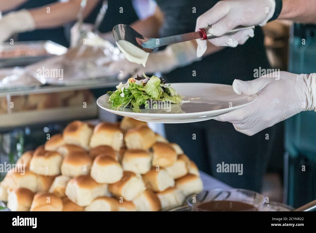 Closeup of waiters serving food in a restaurant Stock Photo - Alamy
