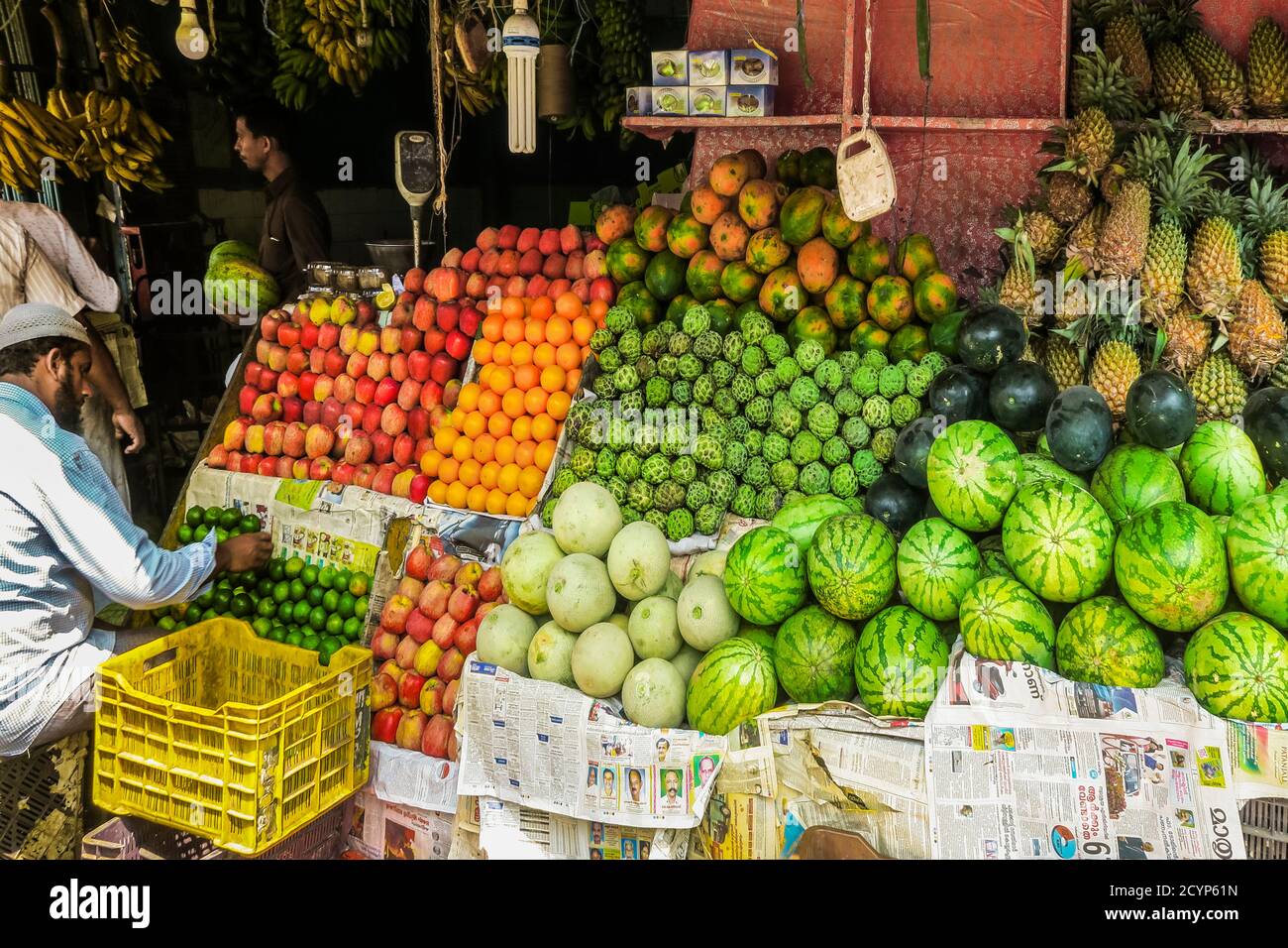 Watermelons, pineapples, custard apples & other fruit at a stall near ...