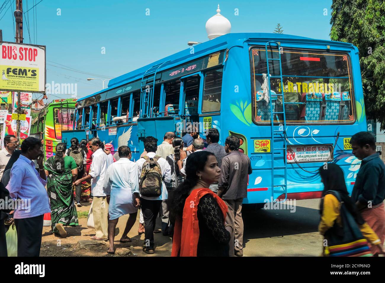 Busy, colourful bus stop and mosque in the centre of this important ...