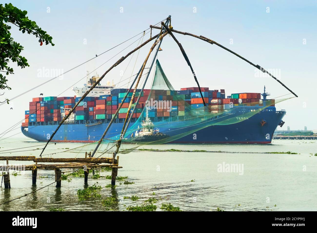 Container ship & a traditional Chinese fishing net on Vembanad Lake en ...