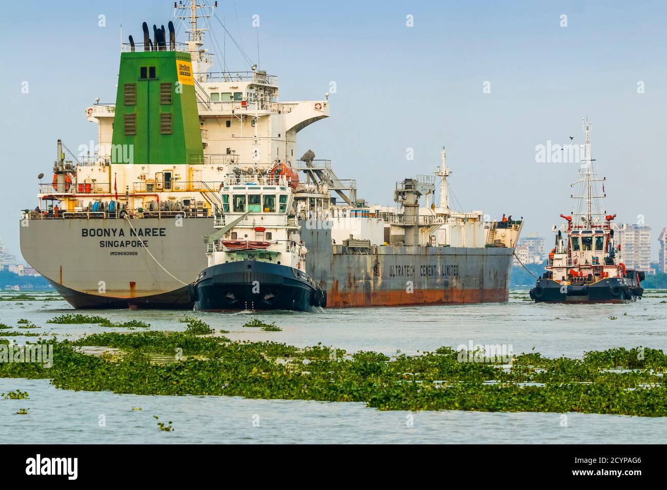 Cement ship & pilot tug boats on Vembanad Lake near the large ...