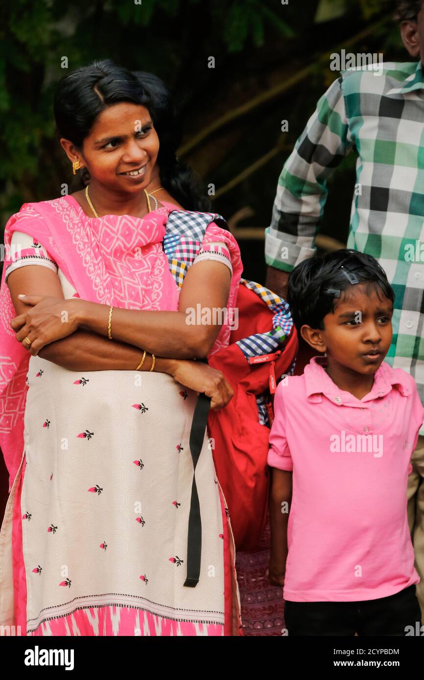 Woman & child waiting for the ferry to Fort Vypin on the Fort Cochin ...