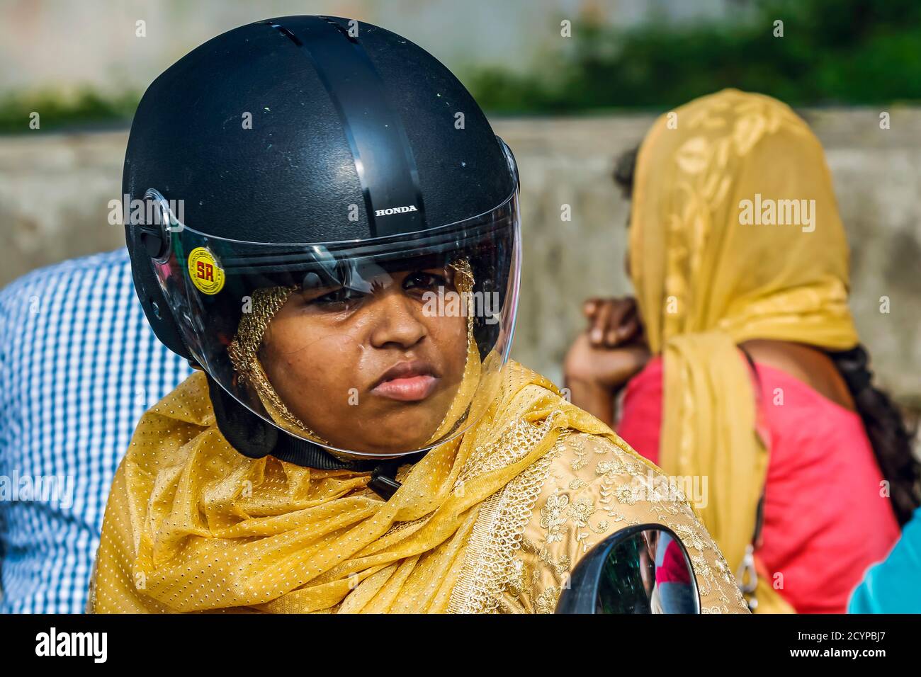 Woman in motorcycle helmet on the vehicle and passenger ferry to Fort ...