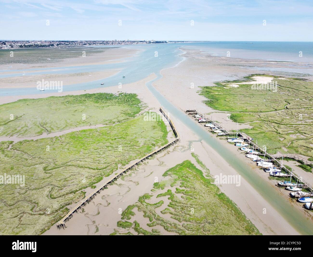 aerial view of wetland and a boats mooring at the end of canvey island ...