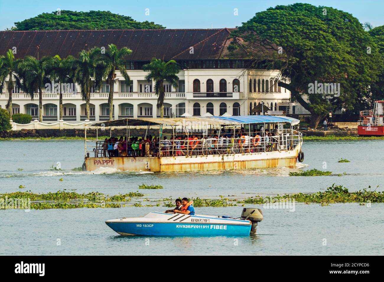 Waterfront of Fort Cochin with speed boat and ferry boat 'Pappy' that ...