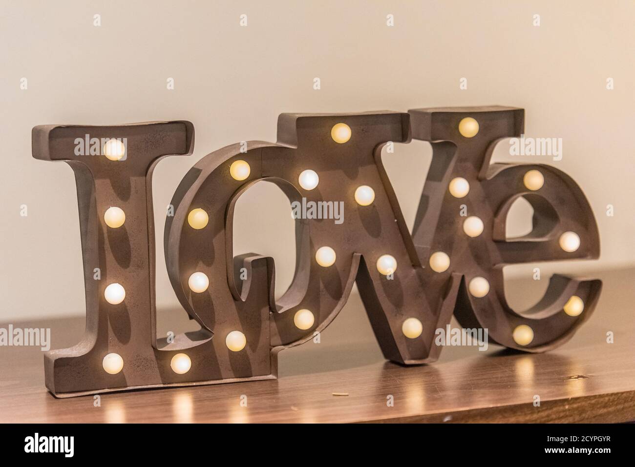 Wording Love sign with light bulb Stock Photo - Alamy
