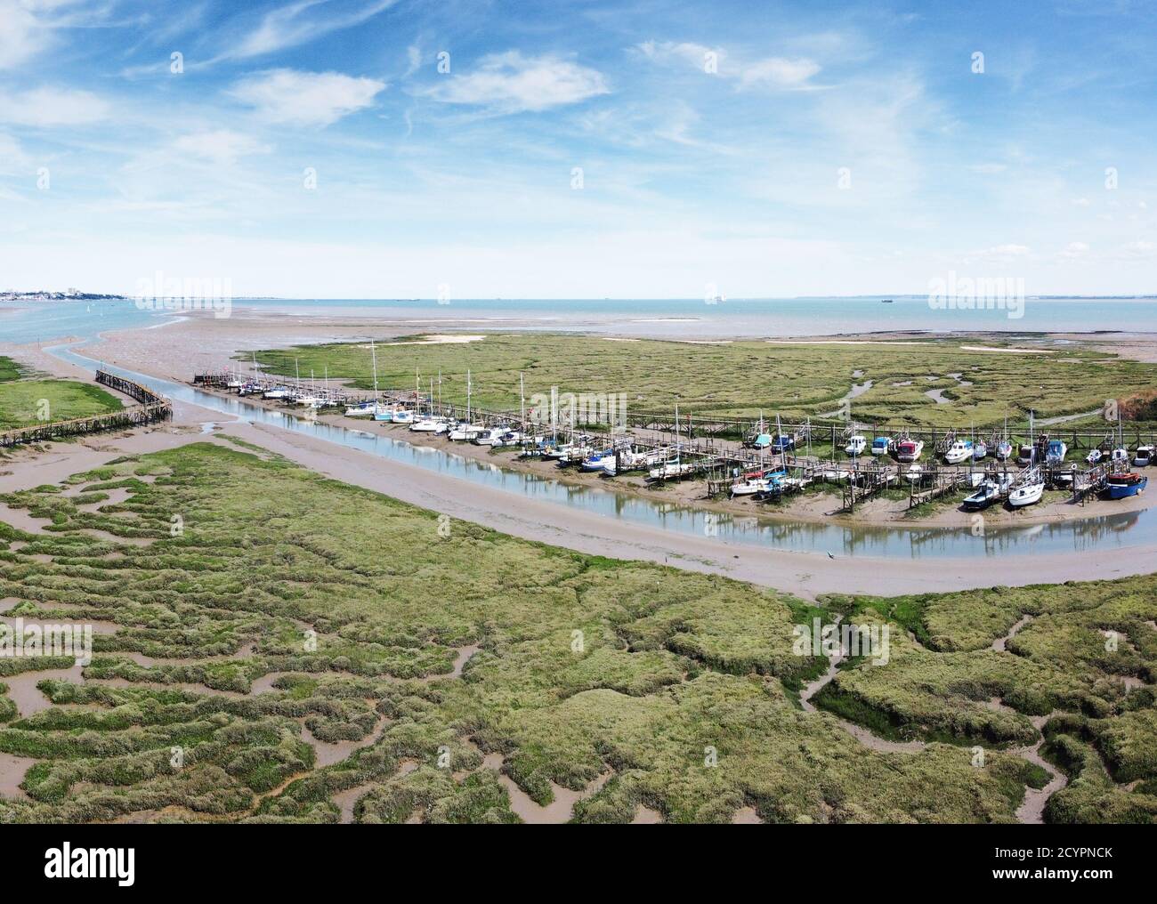 aerial view of wetland and a boats mooring at the end of canvey island ...