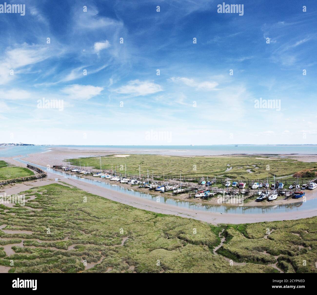 aerial view of wetland and a boats mooring at the end of canvey island ...