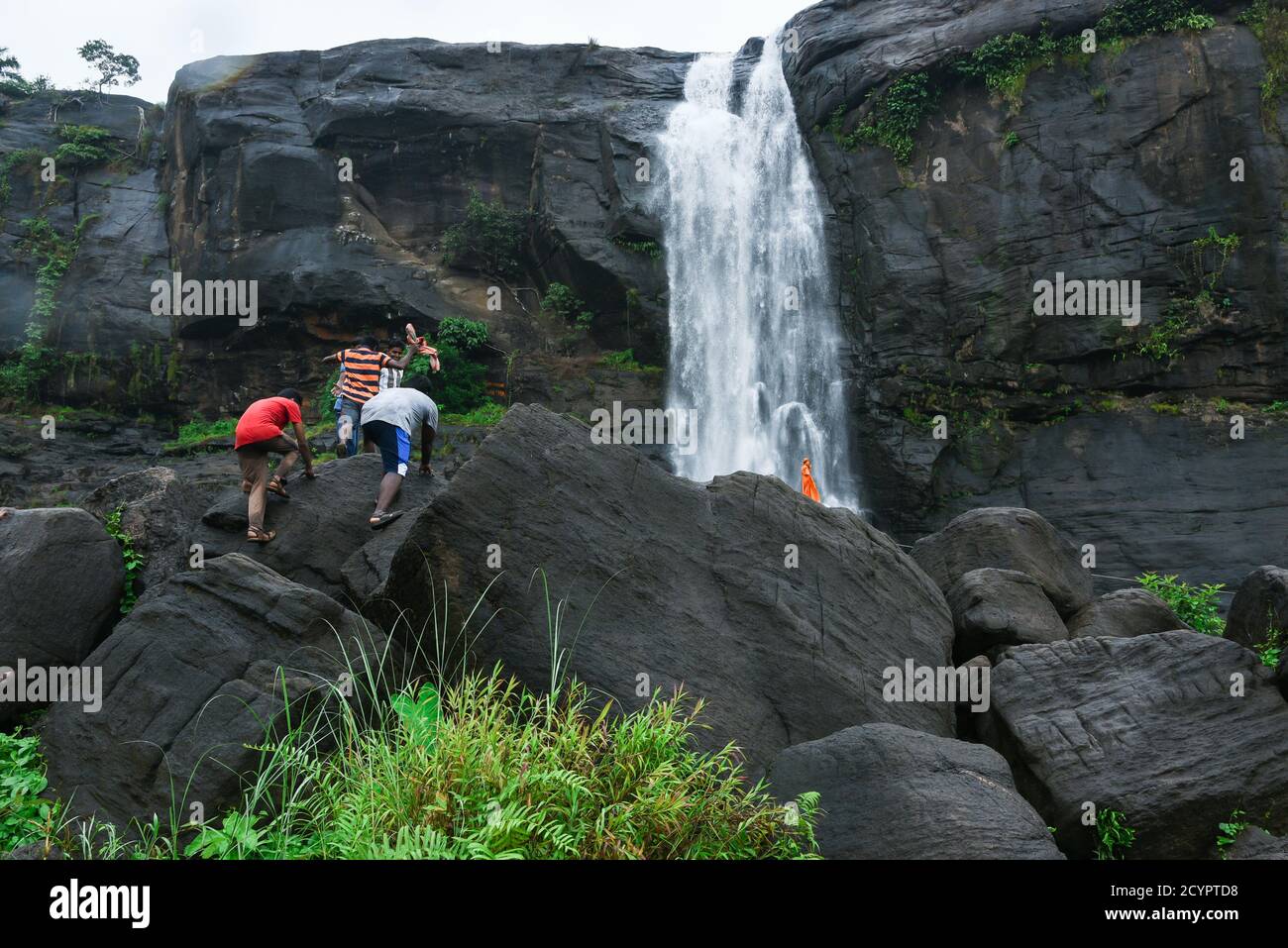 Misty forest and rocks, soothing Athirapally Vazhachal waterfall in ...