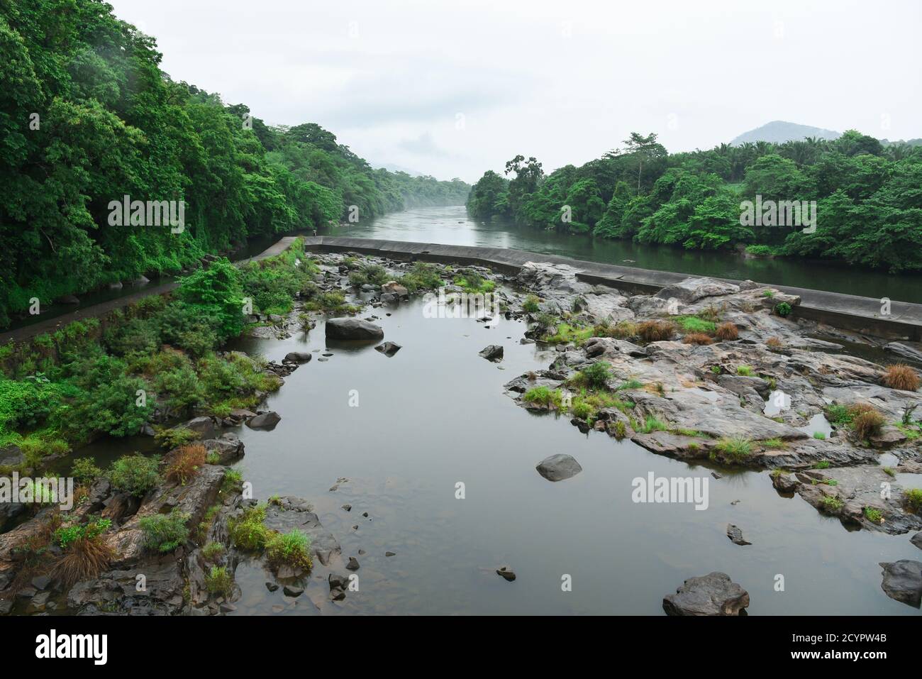 Misty forest and rocks, soothing Athirapally Vazhachal waterfall in ...
