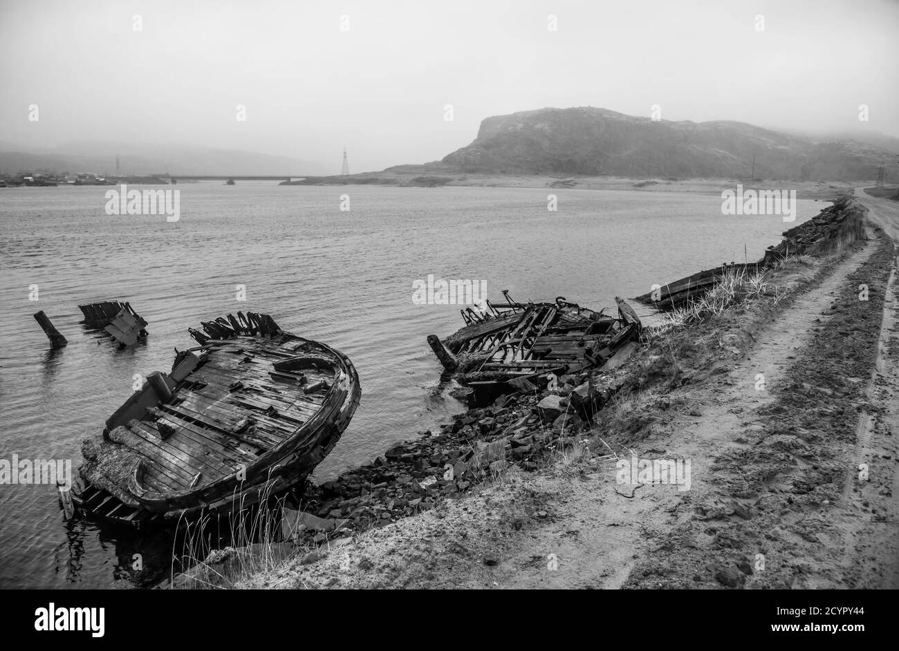 Ships graveyard in the water of the Barents Sea, Teriberka, Russia ...