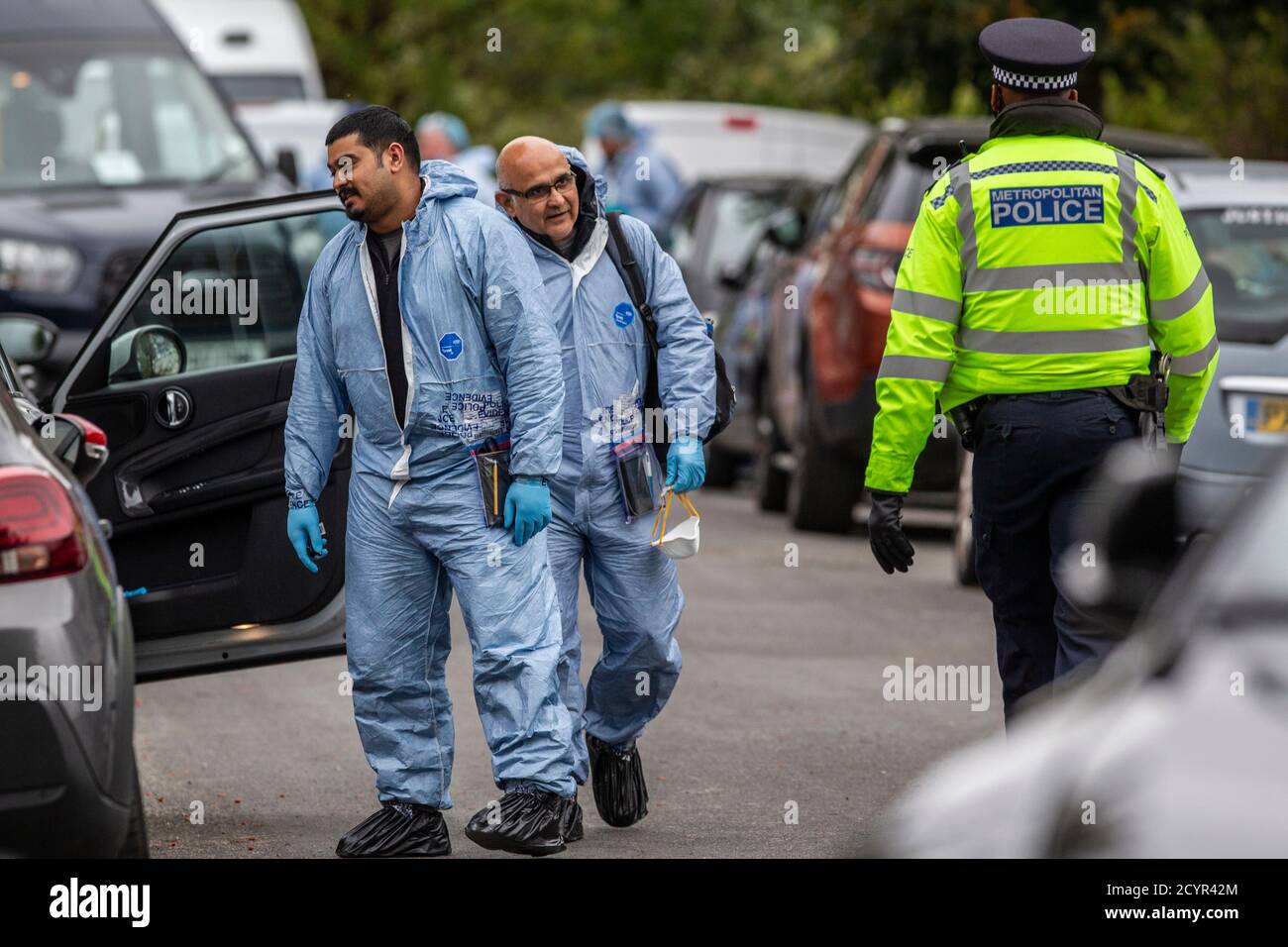 Metropolitan Police officers and Forensic officers outside the address ...