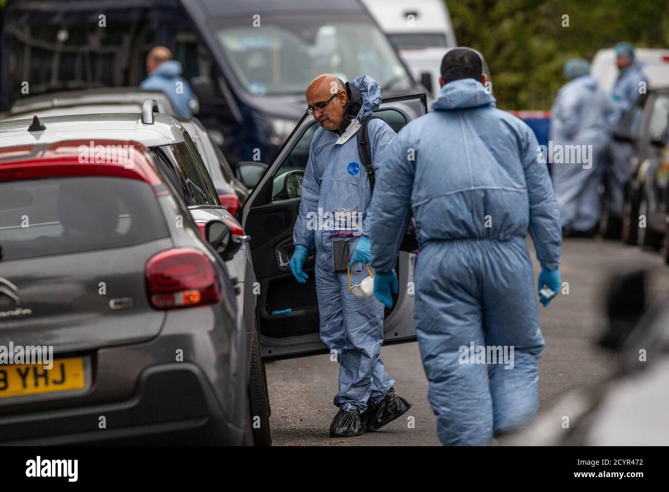 Metropolitan Police officers and Forensic officers outside the address ...