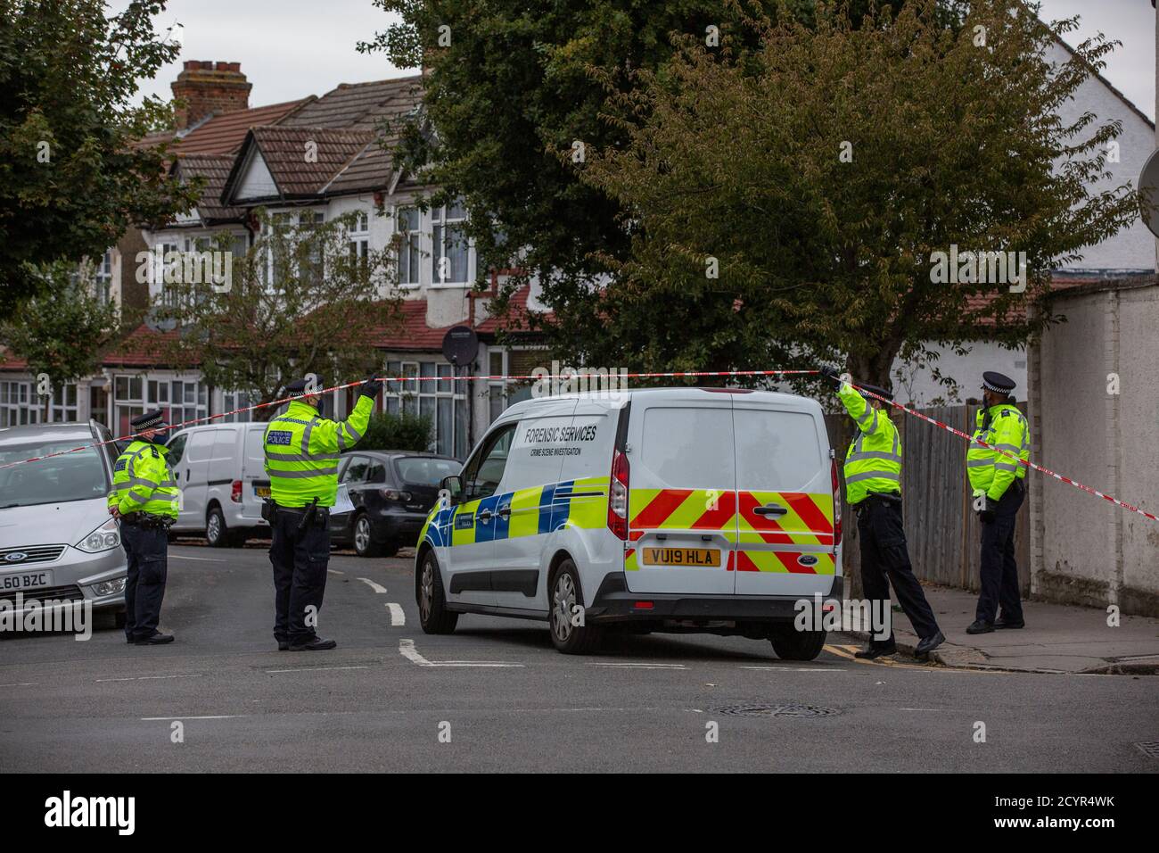 Metropolitan Police officers and Forensic officers outside the address ...