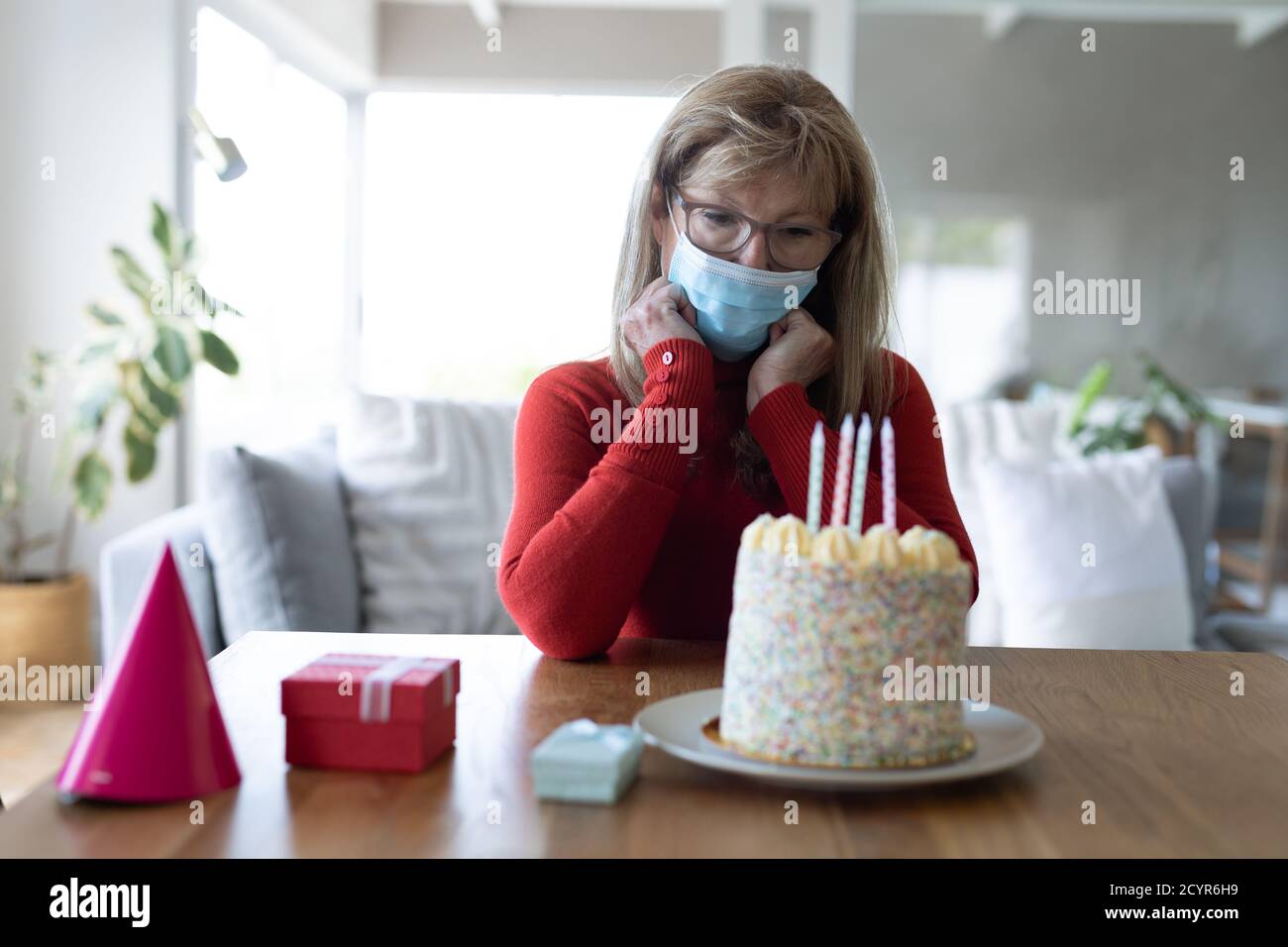Senior Caucasian woman spending time at home, sitting in her living ...