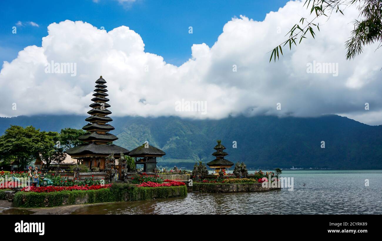 View of a Hindu temple building on the edge of a lake in Bali ...