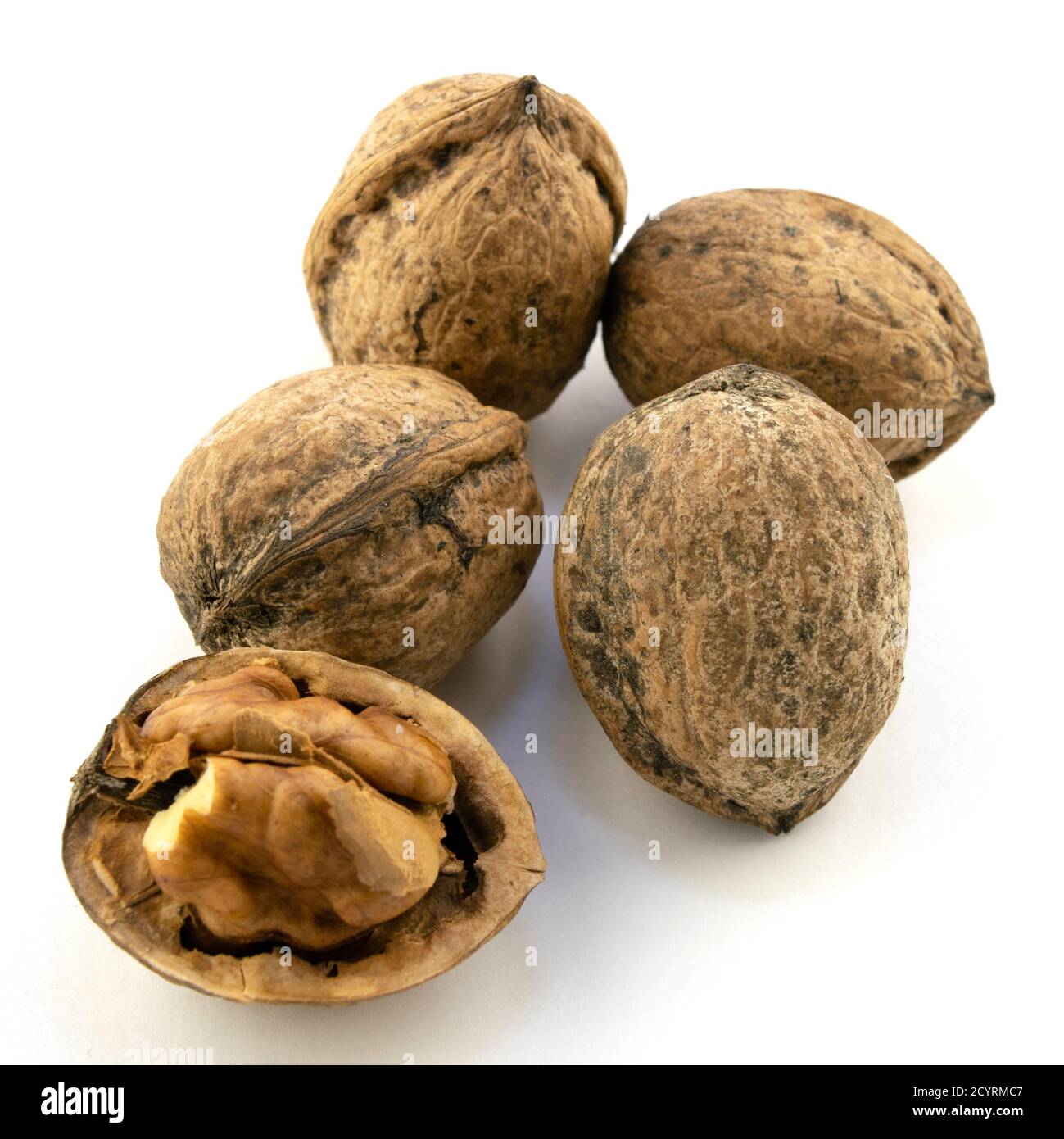 whole and peeled walnut kernels on a white background Stock Photo - Alamy