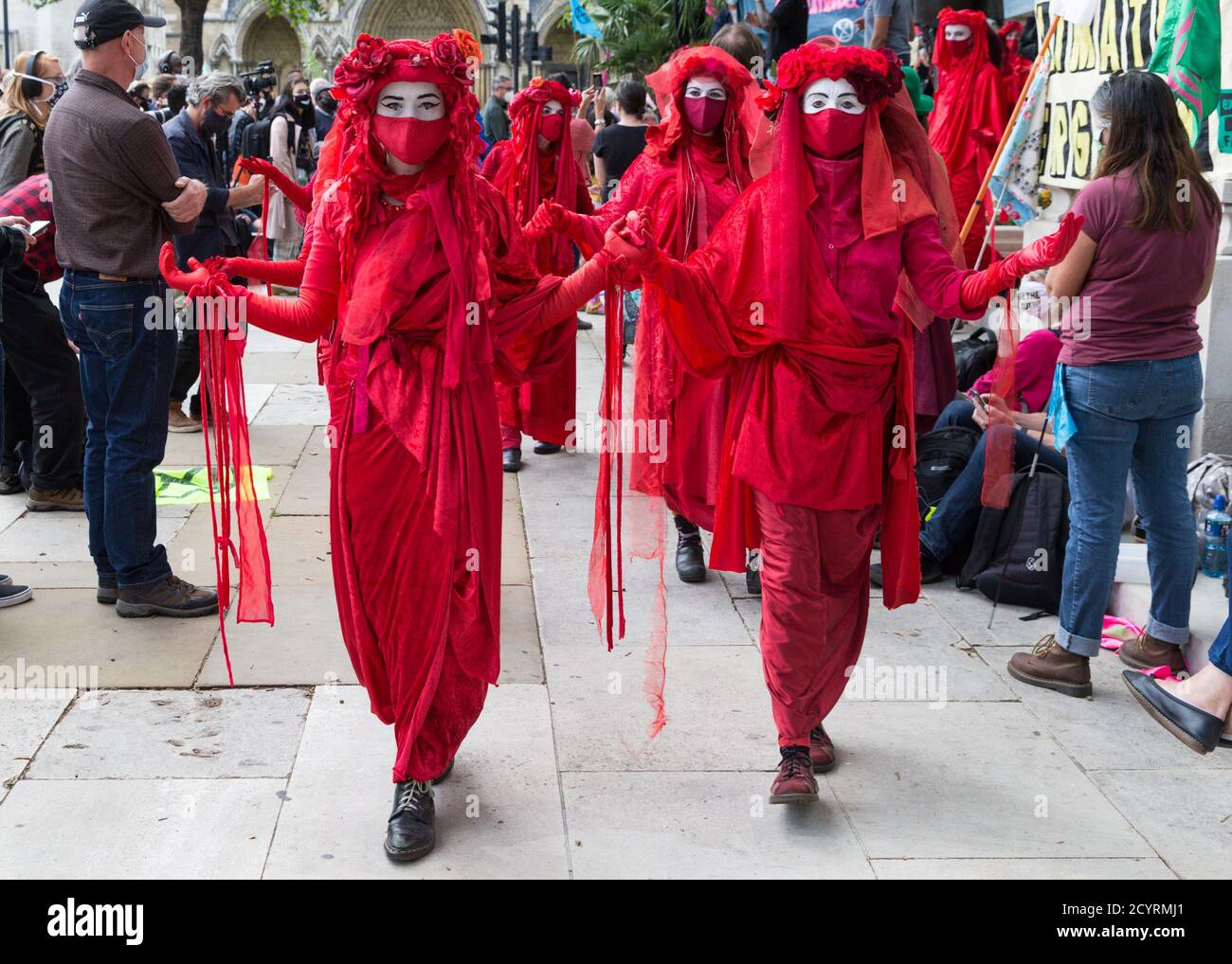 XR Red Rebels pose at first day of the Extinction Rebellion staged at ...