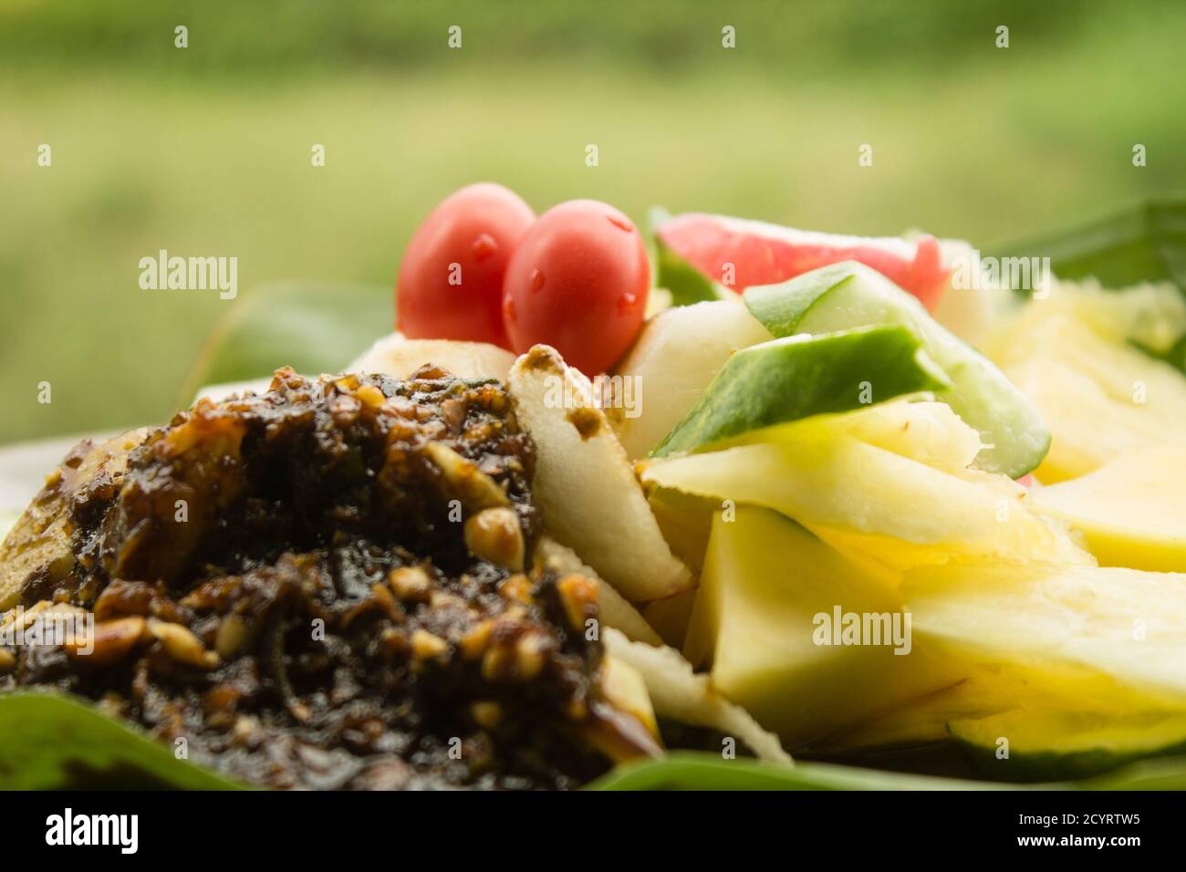 Tropical fruits salad with peanuts sauce, typical Indonesian salad ...