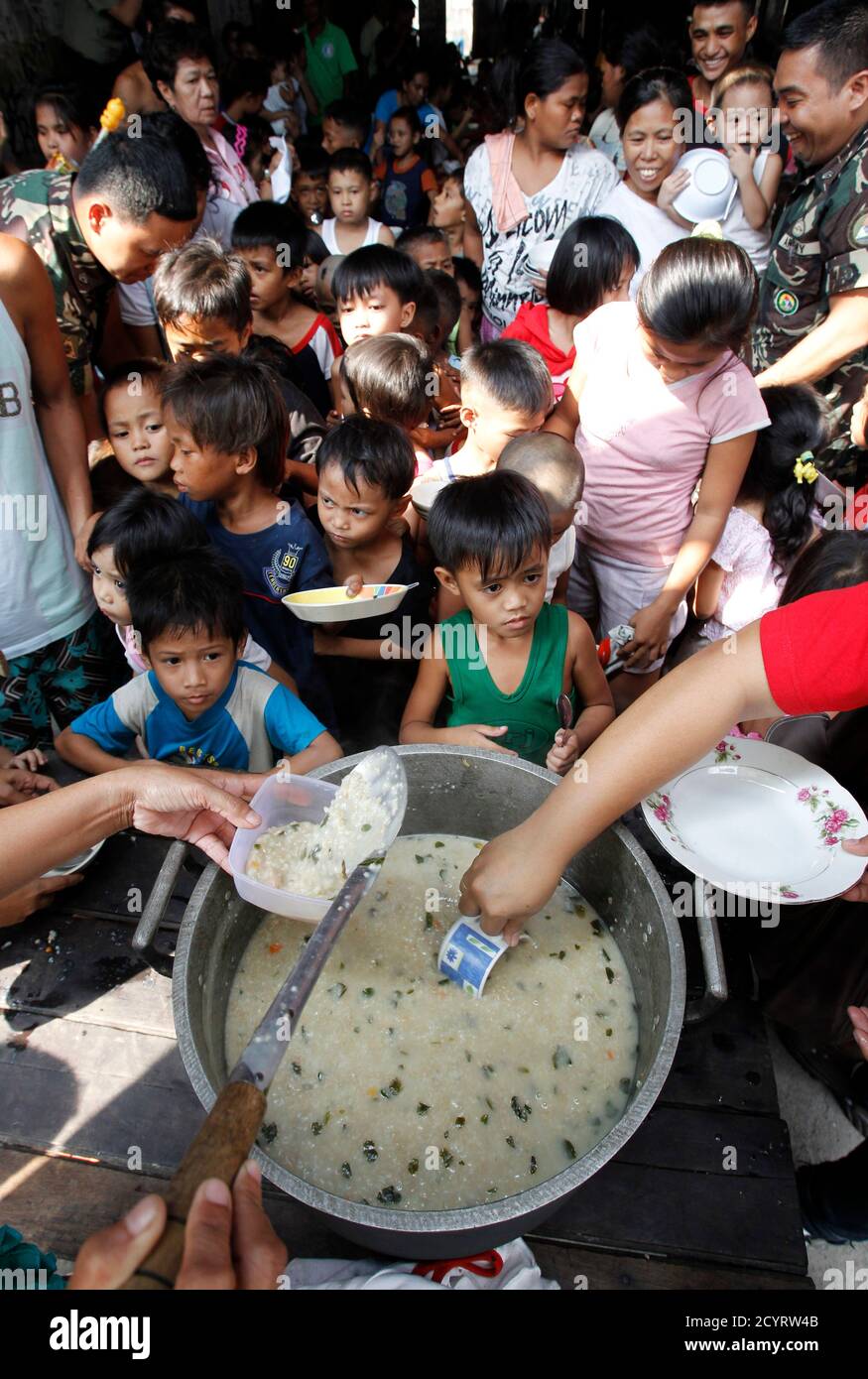 Philippines feeding program hi-res stock photography and images - Alamy