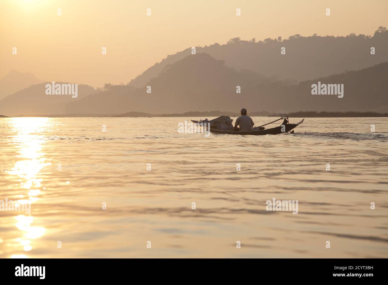 Nam Ou River, boats and landscape with mountains and riverside villages ...