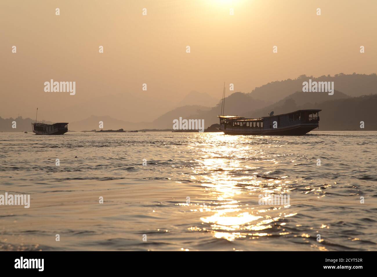 Nam Ou River, boats and landscape with mountains and riverside villages ...