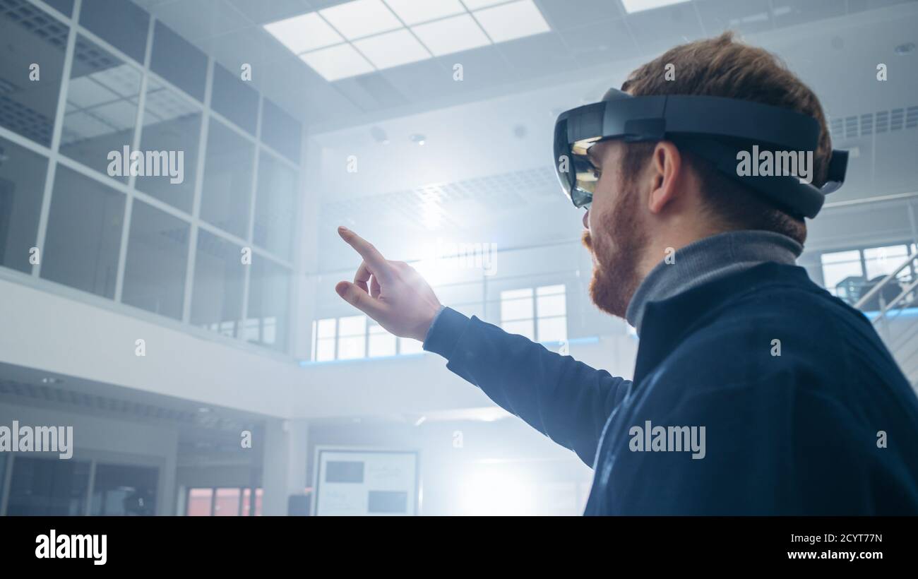 Automotive Engineer Using Augmented Reality Headset and Making Touching ...
