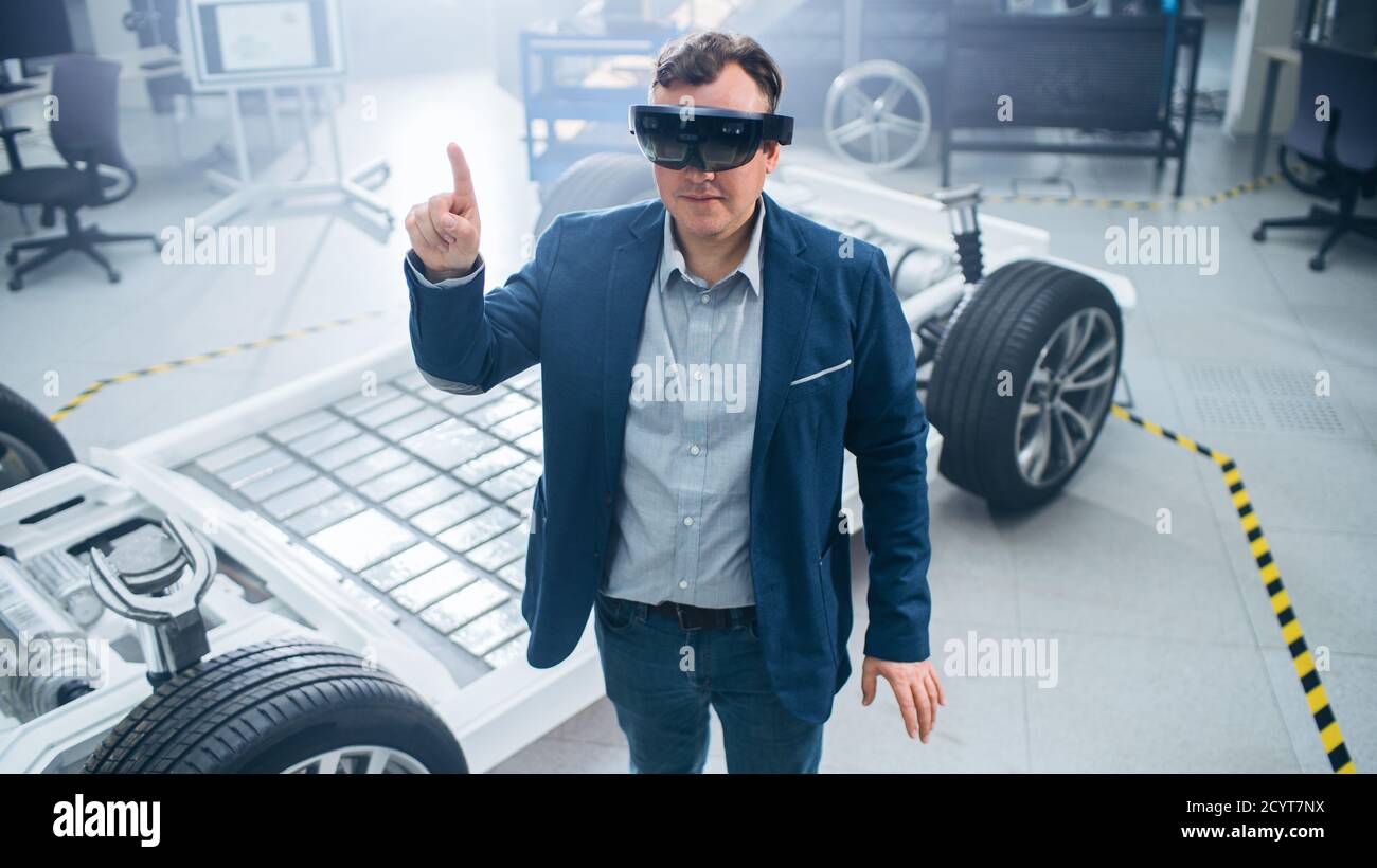 Automotive Engineer Using Augmented Reality Headset Making Touching ...