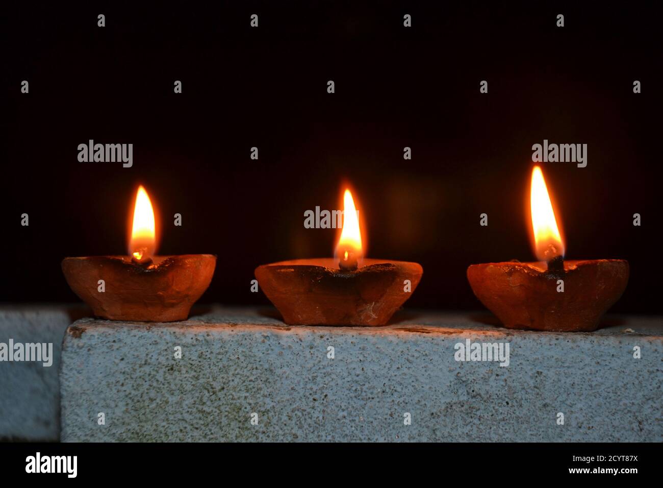 Oil lamps with flame. deepawali or diwali is celebrated by hindus by ...