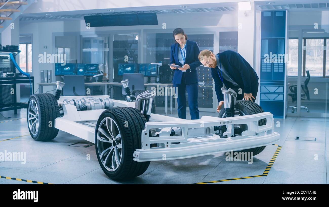 Automotive Design Engineers Working on Electric Car Chassis Prototype ...