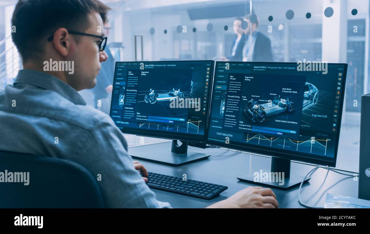 Professional Engineer Works on a Computer with a 3D CAD Software and ...