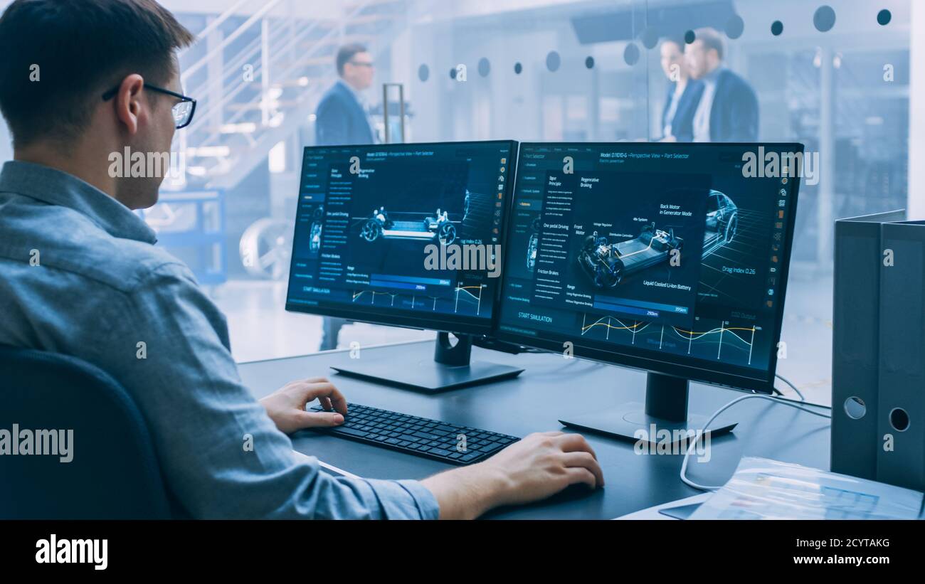 Professional Engineer Works on a Computer with a 3D CAD Software and ...