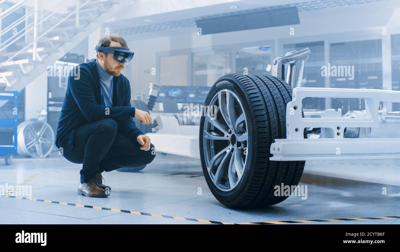 Automotive Engineer Working on Electric Car Chassis Platform, Using ...