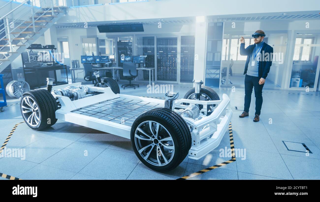 Automotive Engineer Working on Electric Car Chassis Platform, Using ...