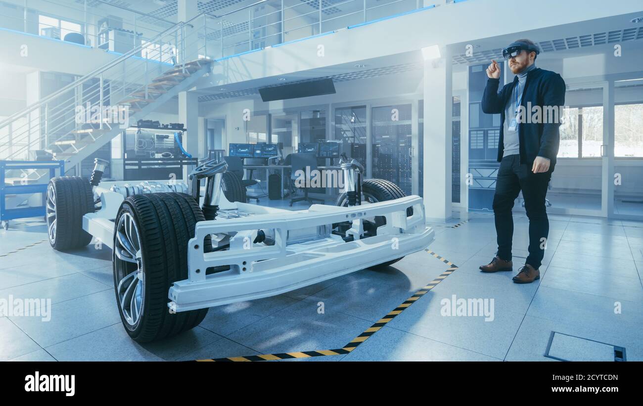 Automotive Engineer Working on Electric Car Chassis Platform, Using ...