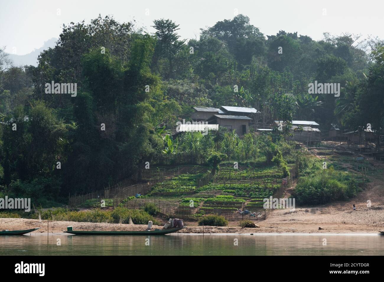 Nam Ou River, boats and landscape with mountains and riverside villages ...