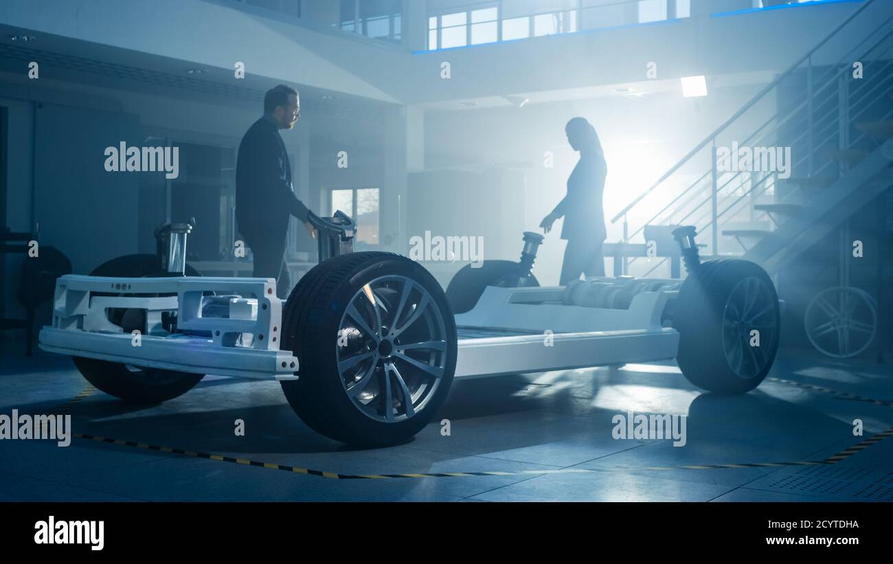 Silhouettes of Two Automobile Design Engineers In Automotive Innovation ...