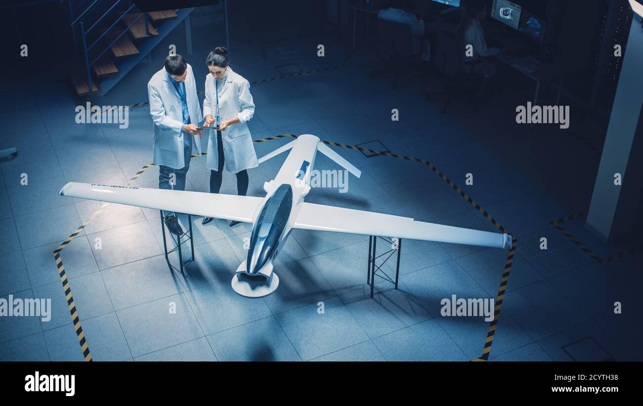 Two Aerospace Engineers Work On Unmanned Aerial Vehicle Drone Prototype ...