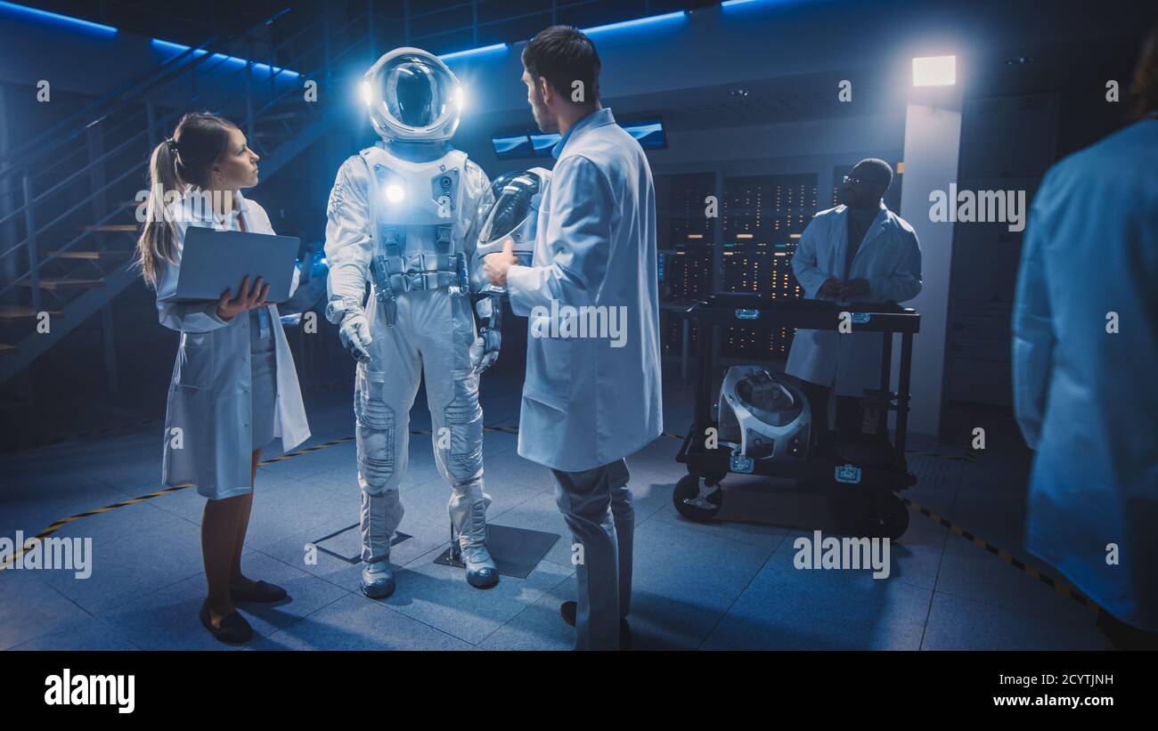 Team of Aerospace Scientists and Engineers Wearing White Coats have ...