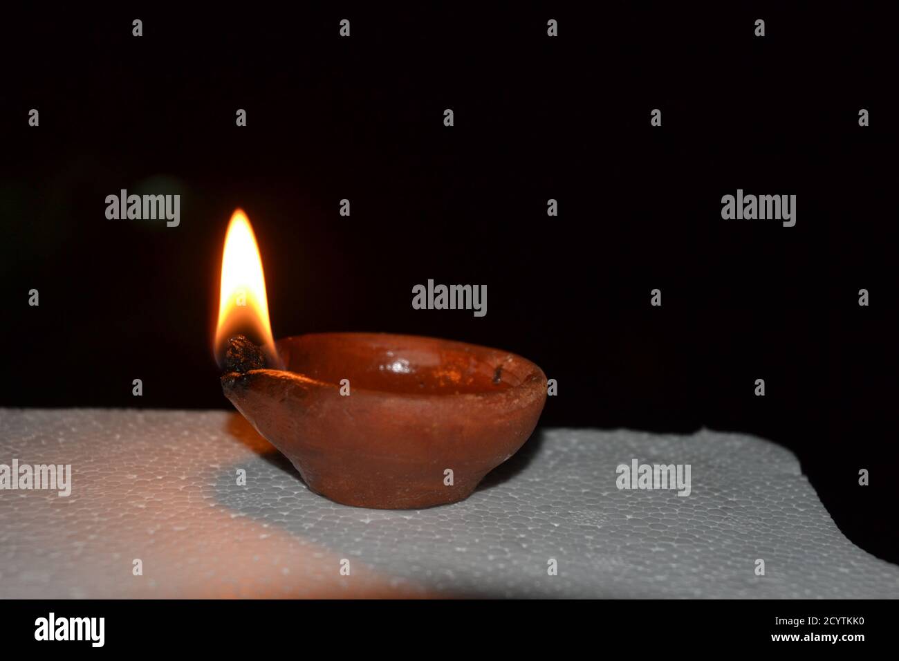 Oil lamps with flame. deepawali or diwali is celebrated by hindus by ...