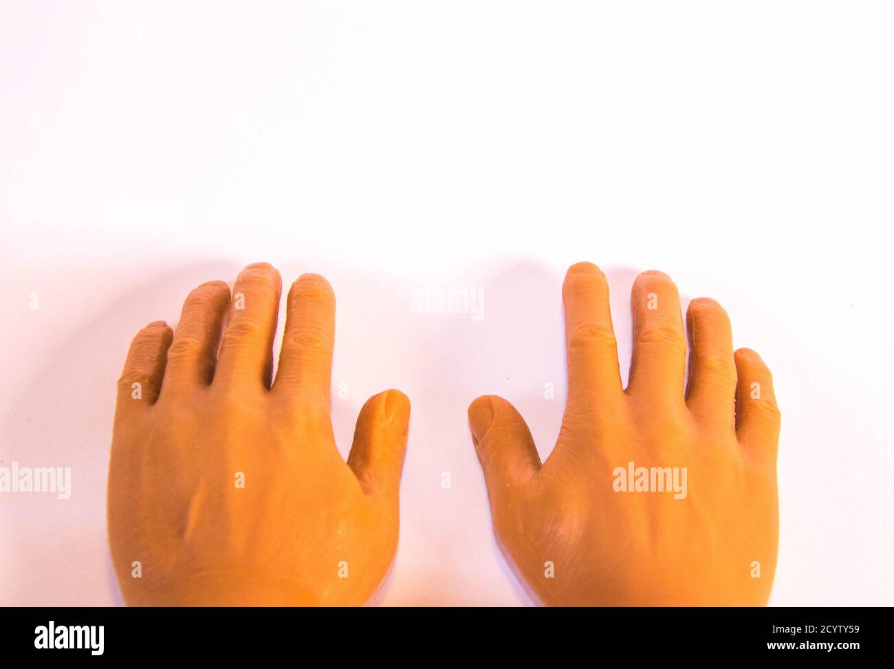 Human adult hands on a white background / desk Stock Photo - Alamy