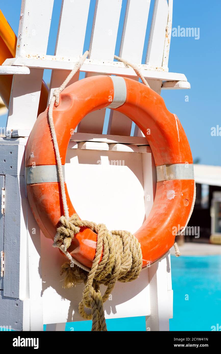 Wooden beach lifeguard tower with save equipment - life preserve, rope ...