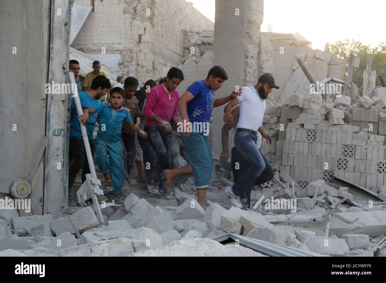 Residents look for survivors hi-res stock photography and images - Alamy