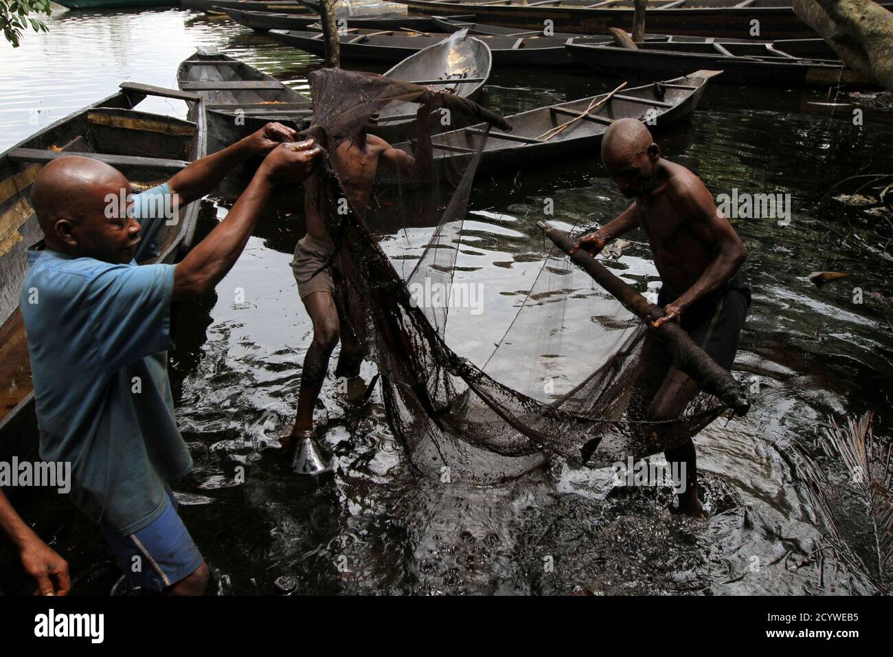 Man fishing in polluted water hi-res stock photography and images - Alamy
