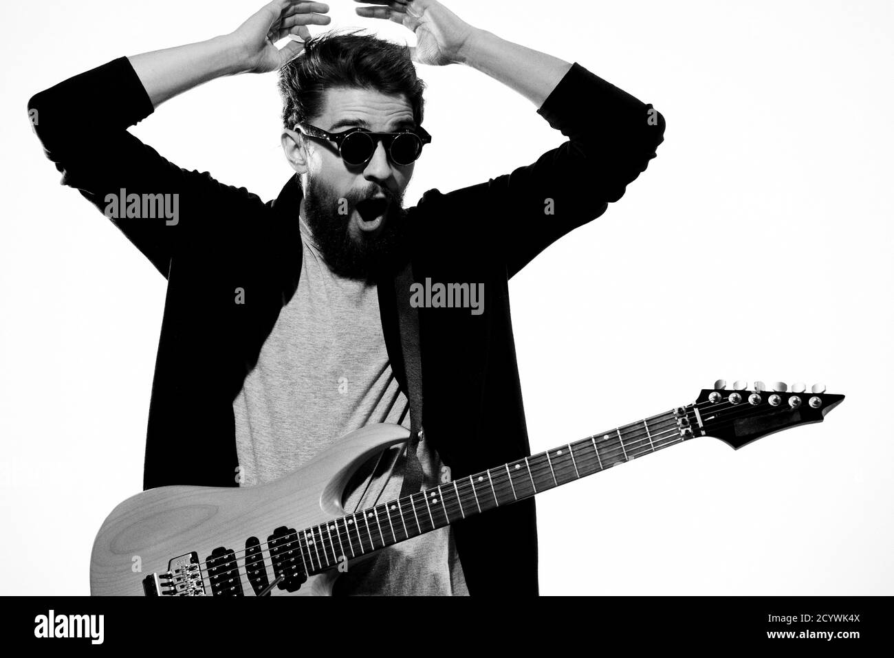 man with guitar in hands musician rock star performance lifestyle light ...