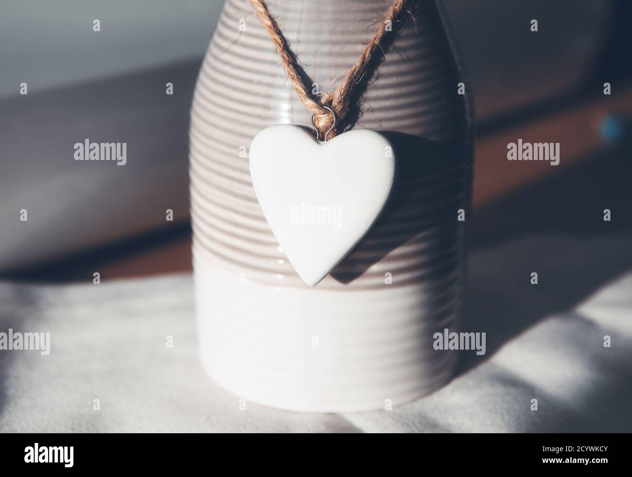 White heart made by stone . Ceramic souvenir Stock Photo - Alamy