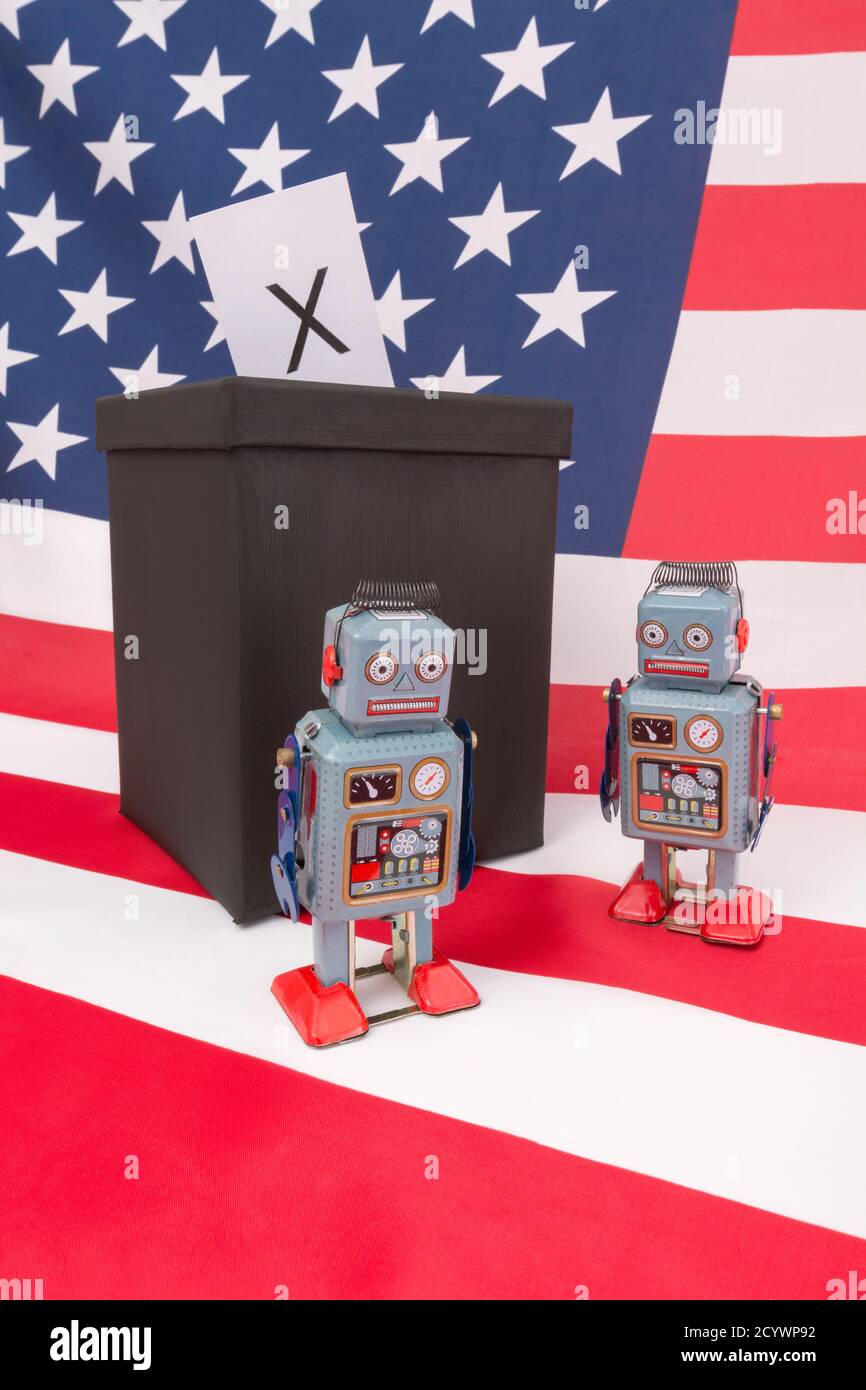 Wind-up clockwork toy robot on American flag / Stars & Stripes. For ...
