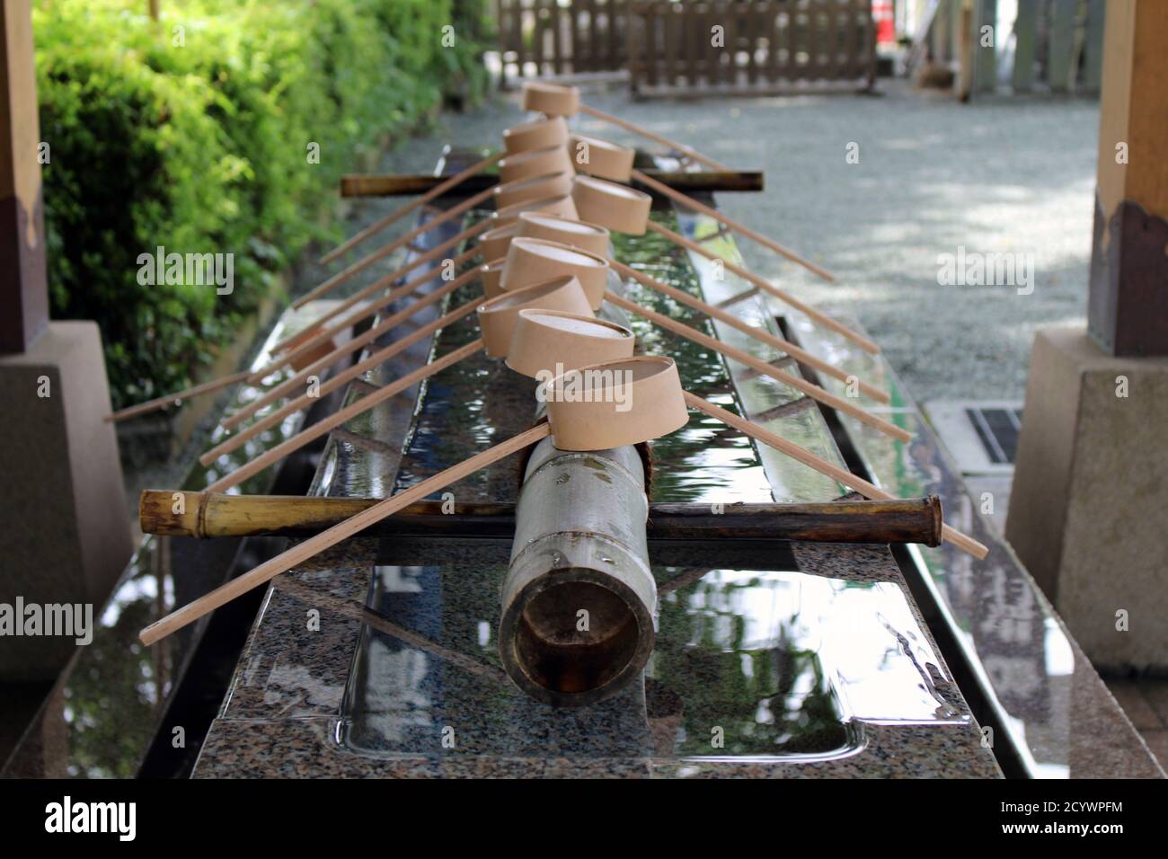 The basin or chozubachi and dippers used in ritual entering Shinto ...