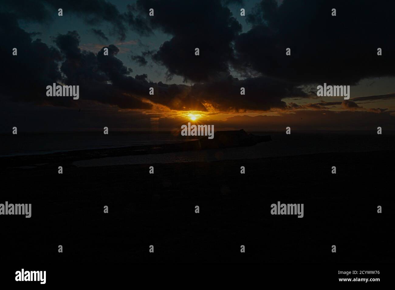 Sunset over Gower Peninsular Rhossilli Bay Worm Rock Formation red ...